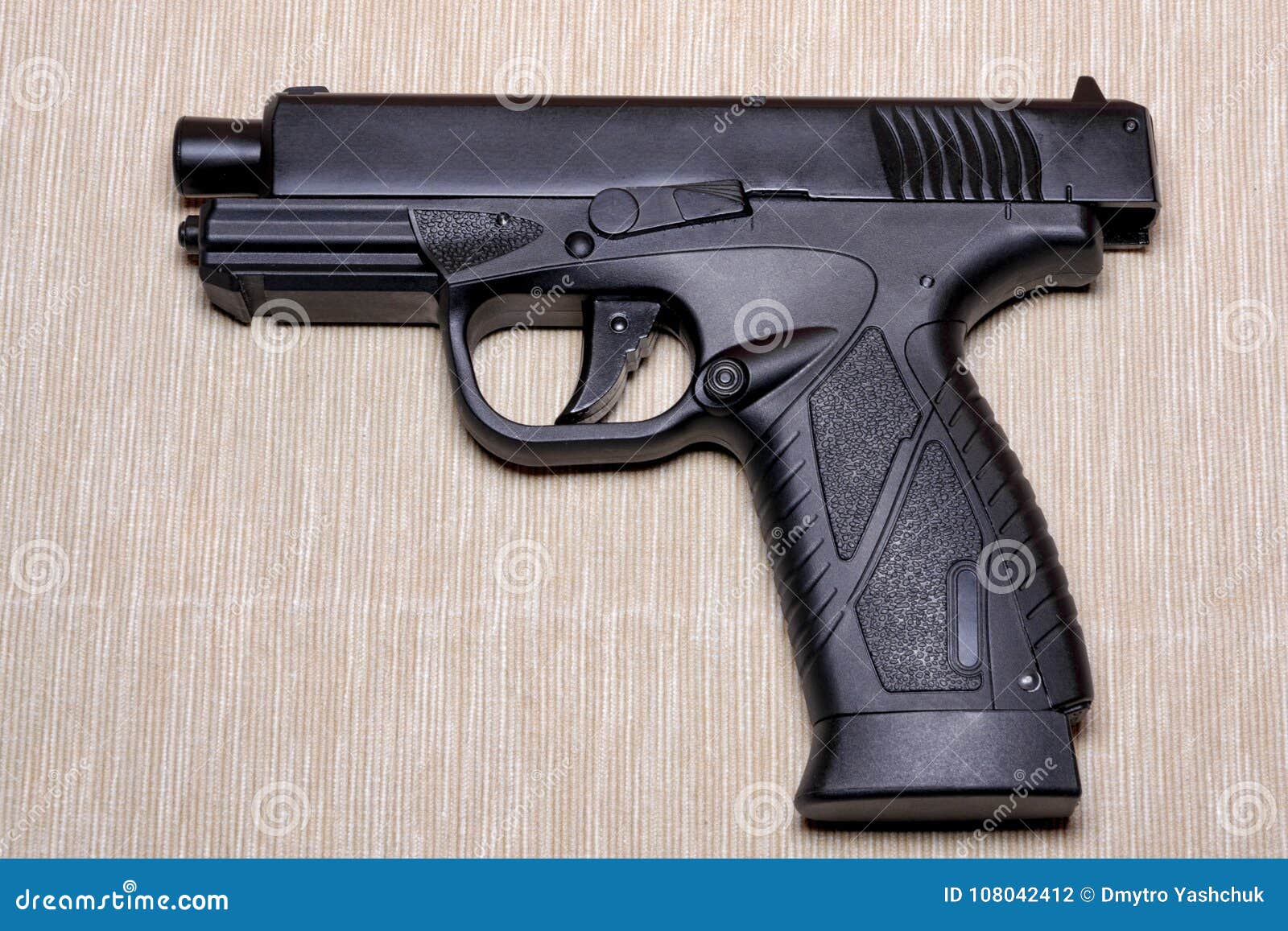 Black Gun Isolated on Light Coloured Background Stock Photo - Image of ...