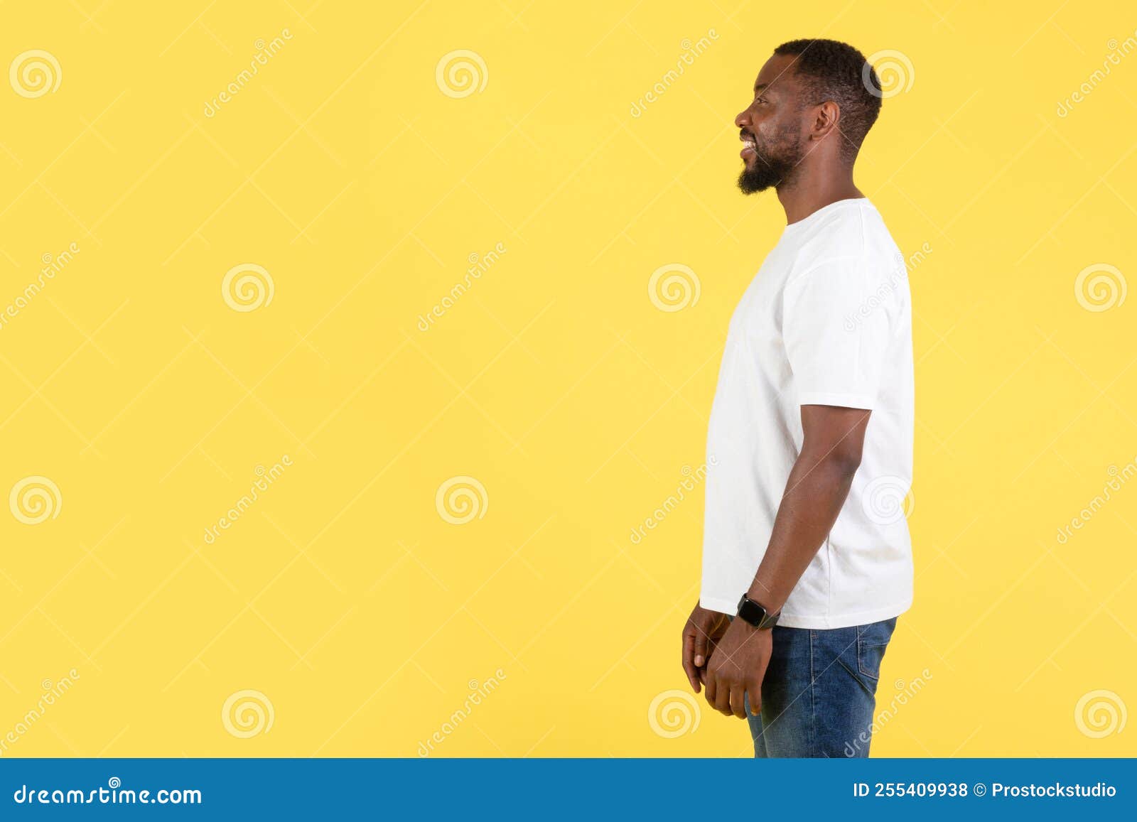 Black Guy Standing Looking Aside Over Yellow Background, Side View ...