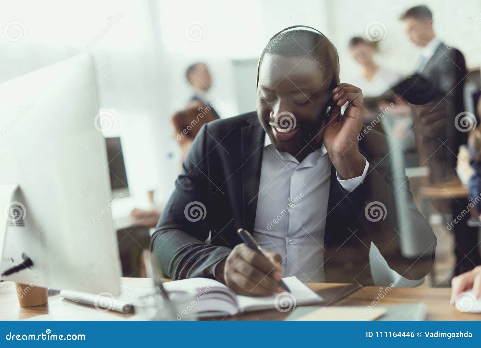 A Black Guy Works As a Call Center Operator. Stock Photo - Image of ...