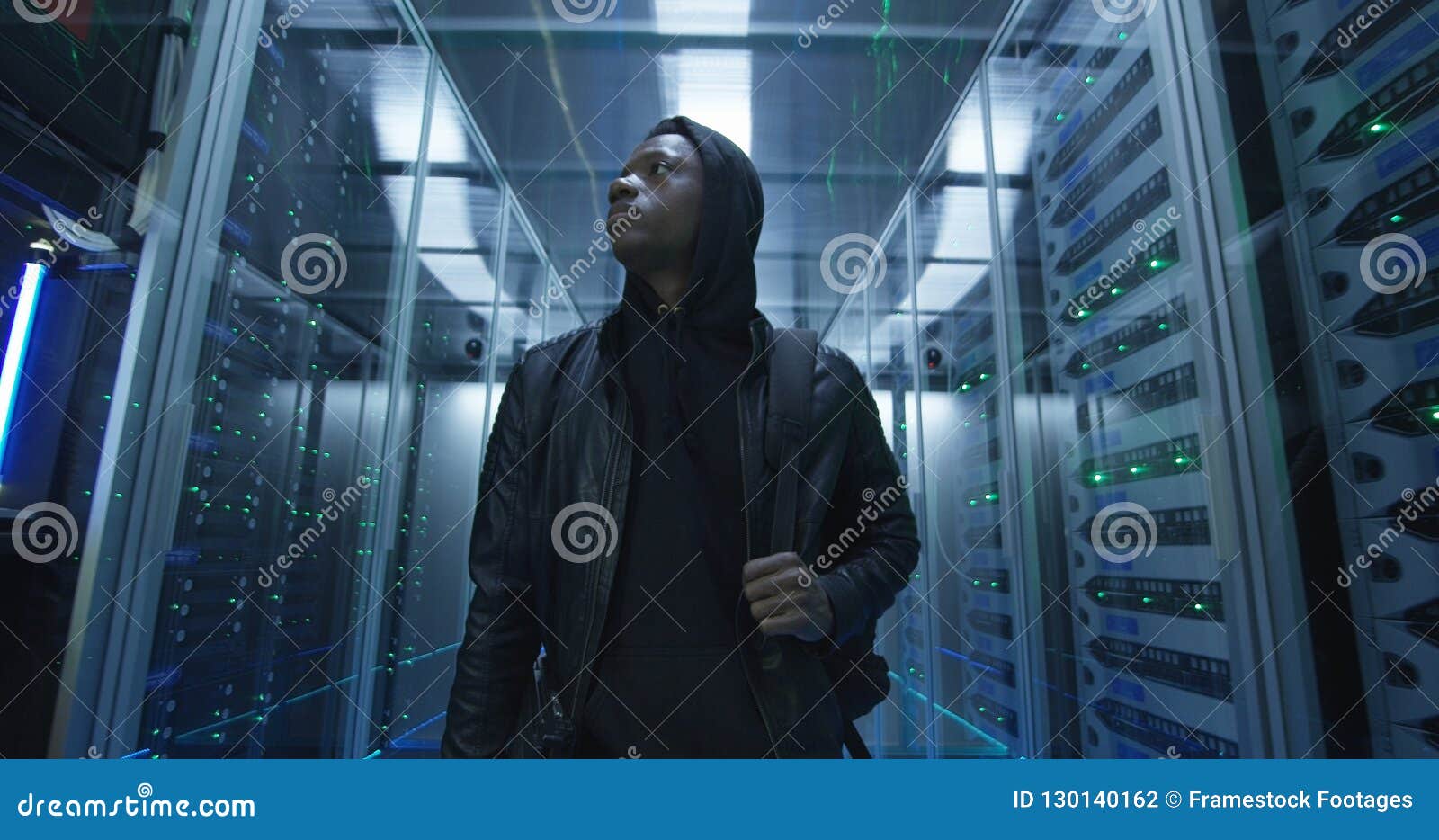 Black Hacker Walking in Server Room Stock Photo - Image of database ...