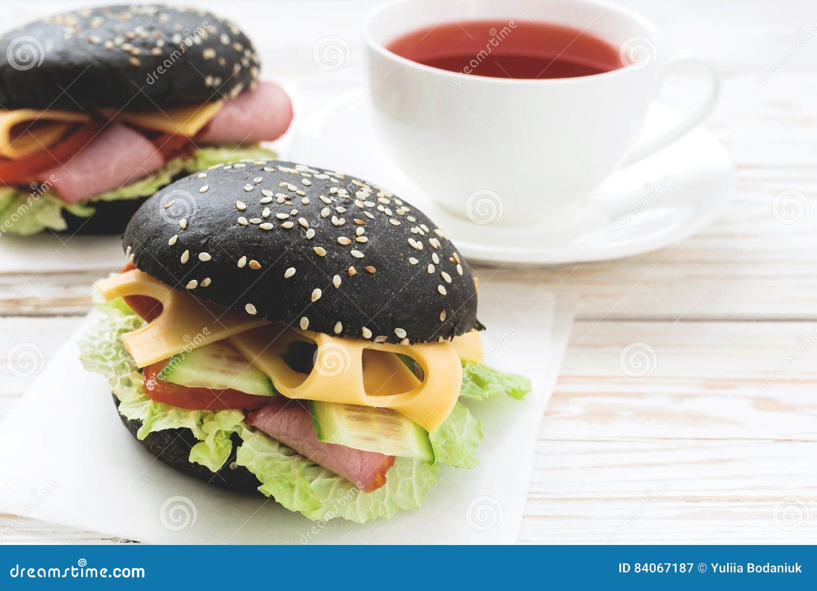 Black Hamburger , Cup of Tea for Breakfast. Stock Image - Image of ...