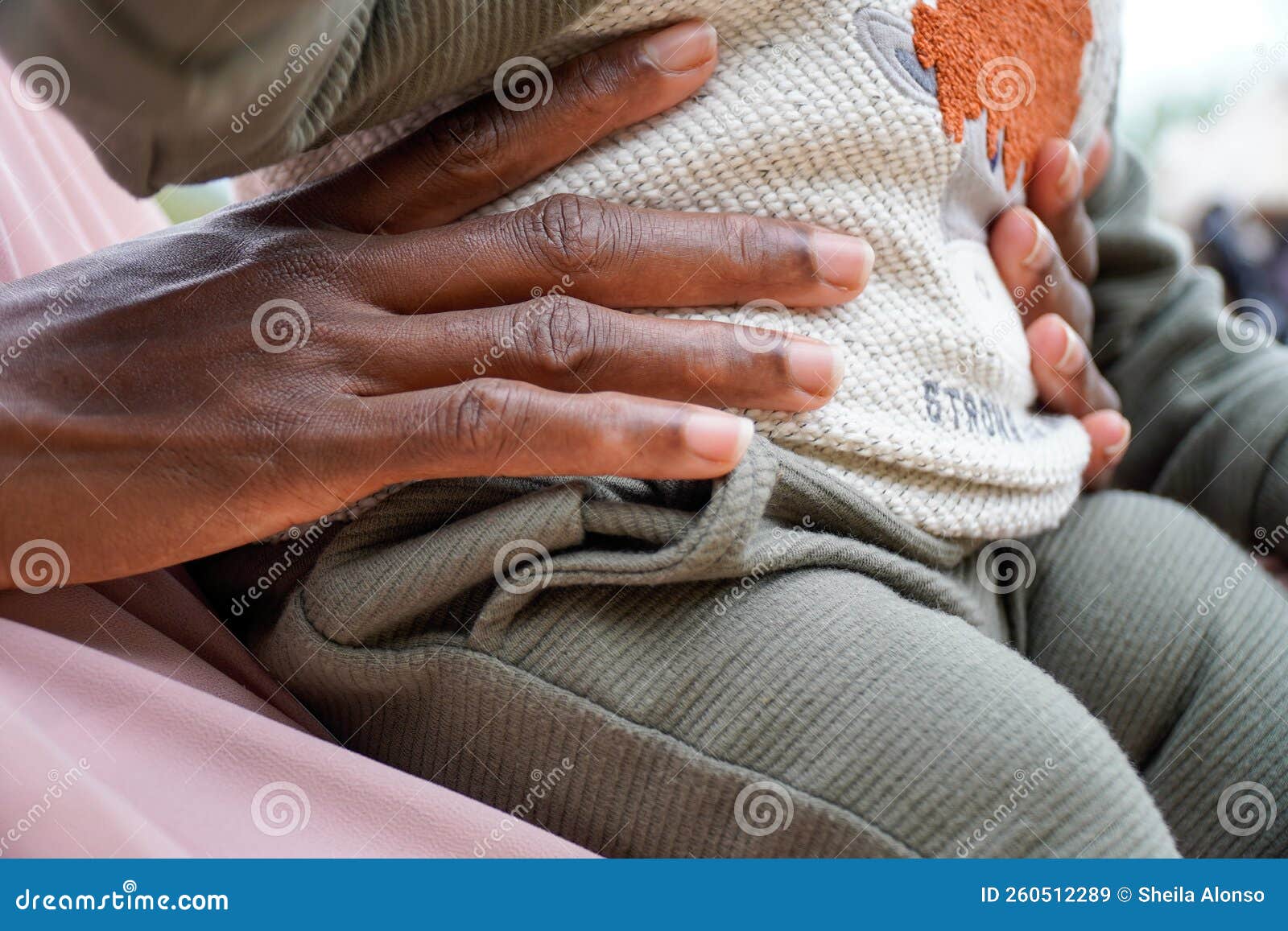 Black Hands of an African Mom Hugging Her Baby. Multicultural Migration ...