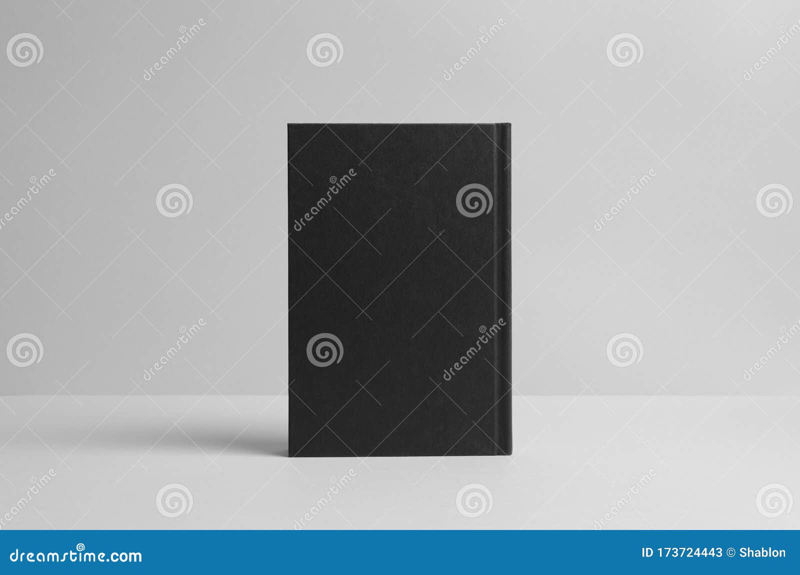 Black Hardcover Book Mock-Up - Backside. Wall Background Stock Image ...