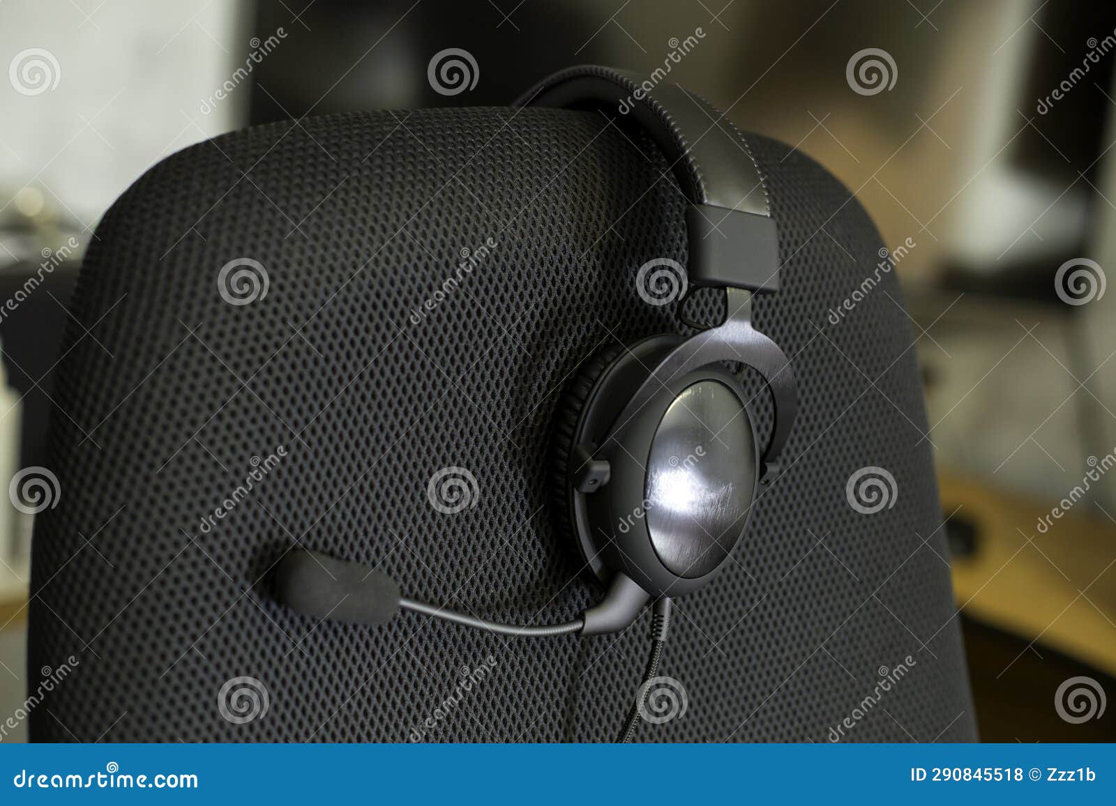 Black Headset on Backrest of Empty Computer Chair with Air Mesh ...