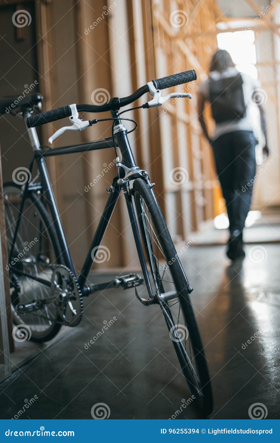Black Hipster Bicycle and Man Walking Behind Stock Photo - Image of ...