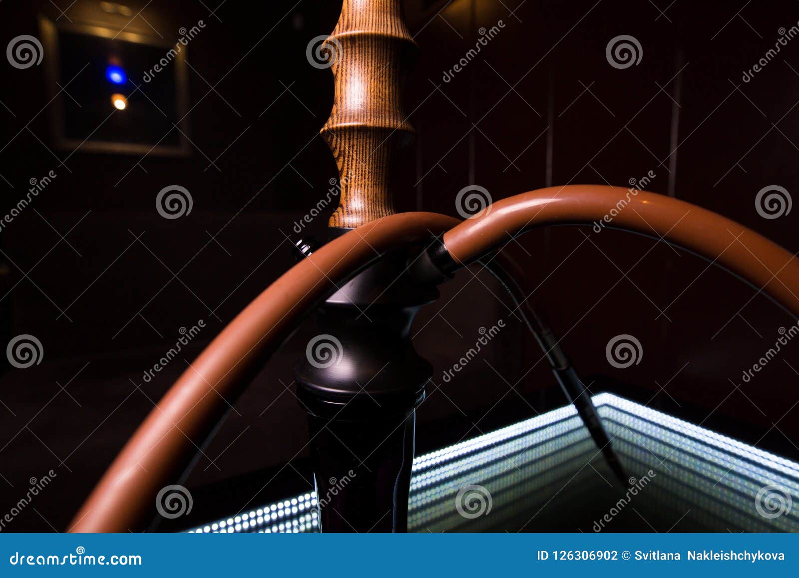 A Black Hookah Stands on a Glass Table Stock Photo - Image of ...