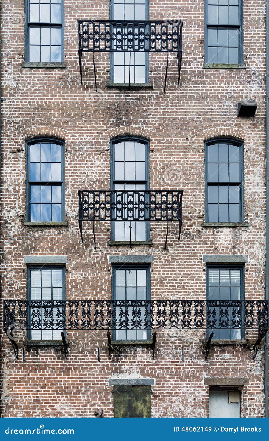 Black Iron Trim on Windows of Old Brick Building Stock Image - Image of ...