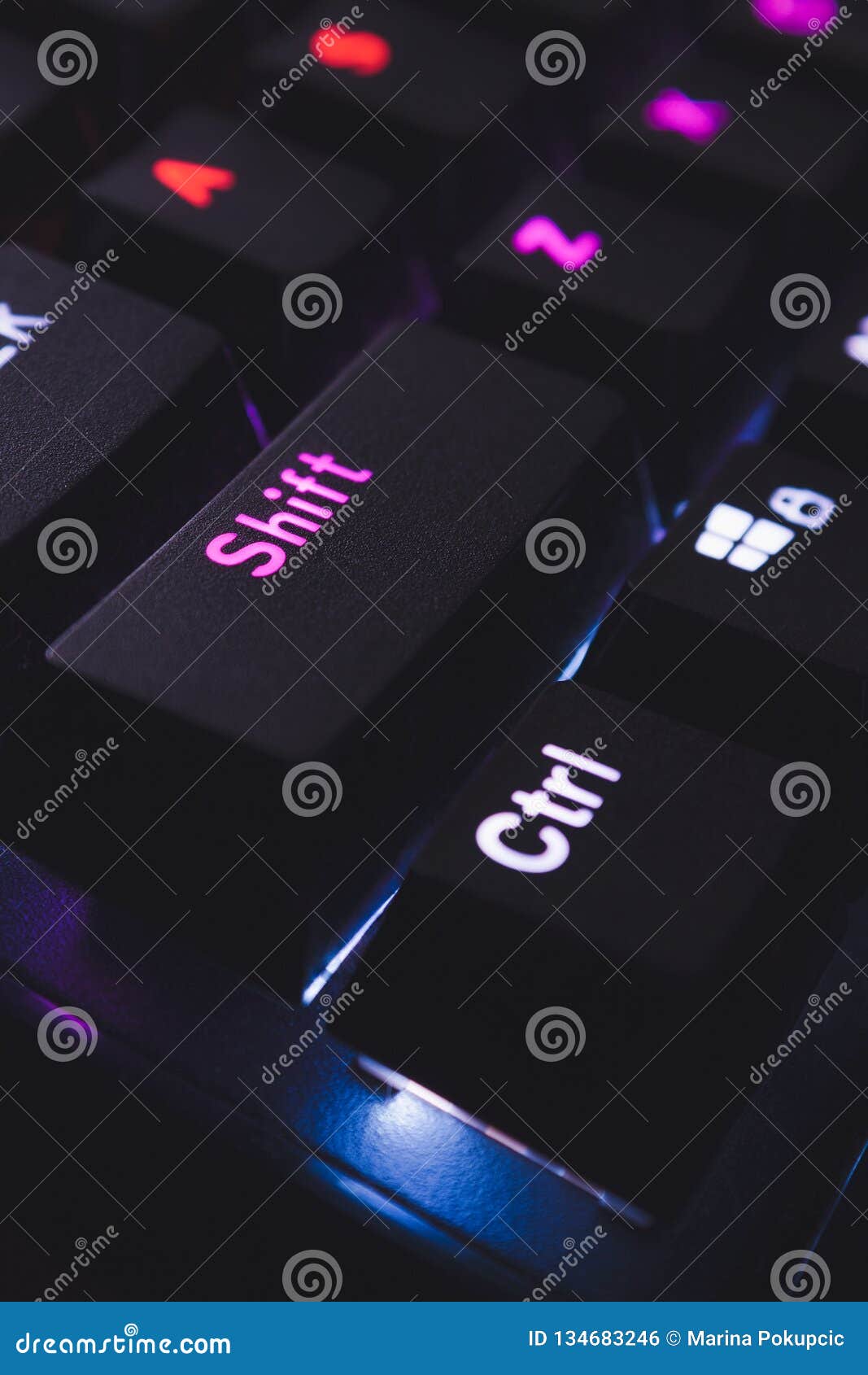 Black Keyboard Keys with Colorful Lights Underneath Stock Photo - Image ...