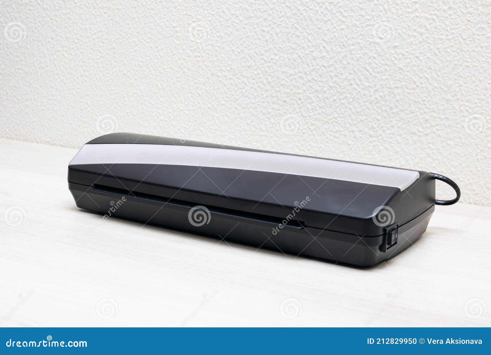 Black Lamination Device on a Wooden Table Stock Photo - Image of film ...