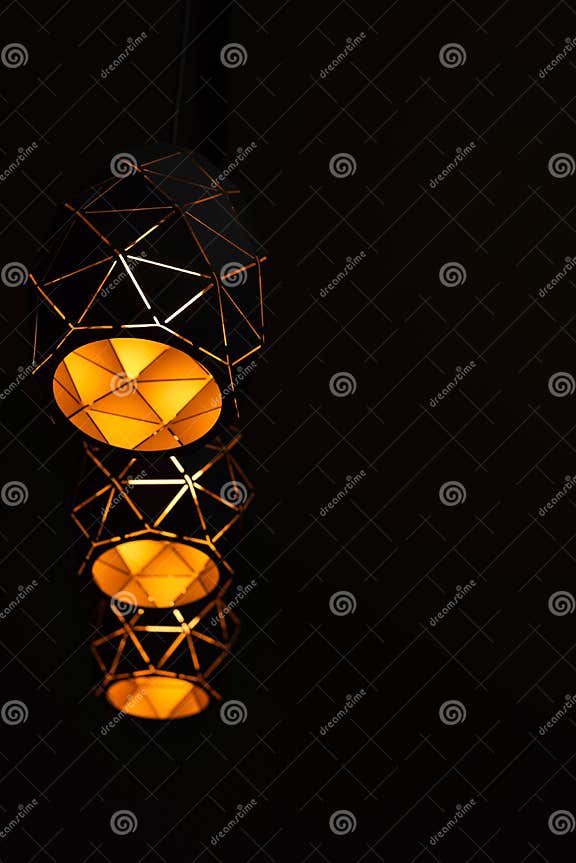 Black Lamps with a Geometric Pattern, Three Lamps on a Black Background ...