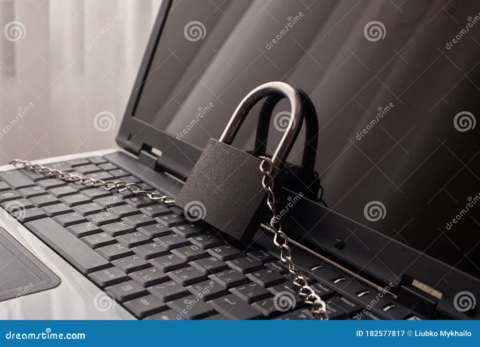 A Black Laptop with a Chain Lock on it Stock Image - Image of datum ...