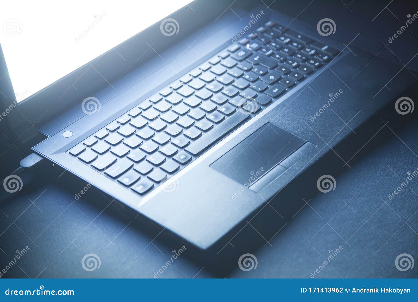Black Laptop on the Black Office Desk. Technology Concept Stock Photo ...