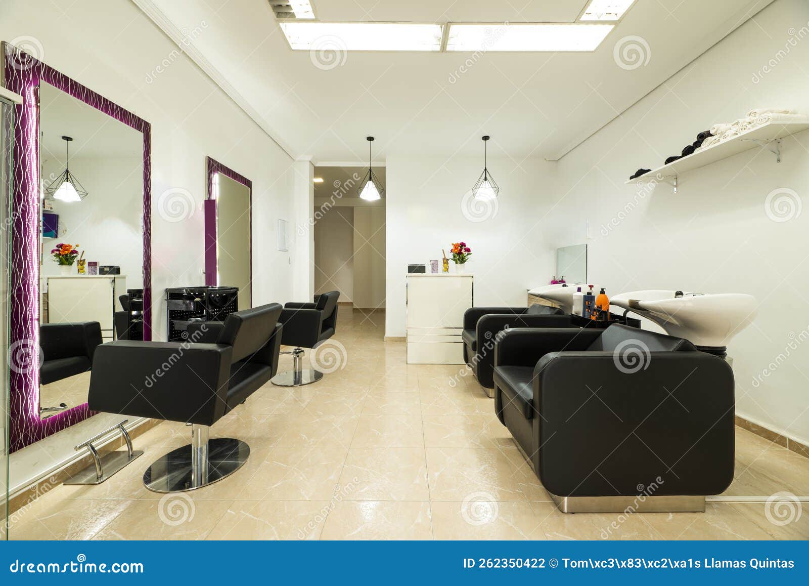 Black Leather Sofas in a Beauty Salon with Rectangular Mirrors on the ...