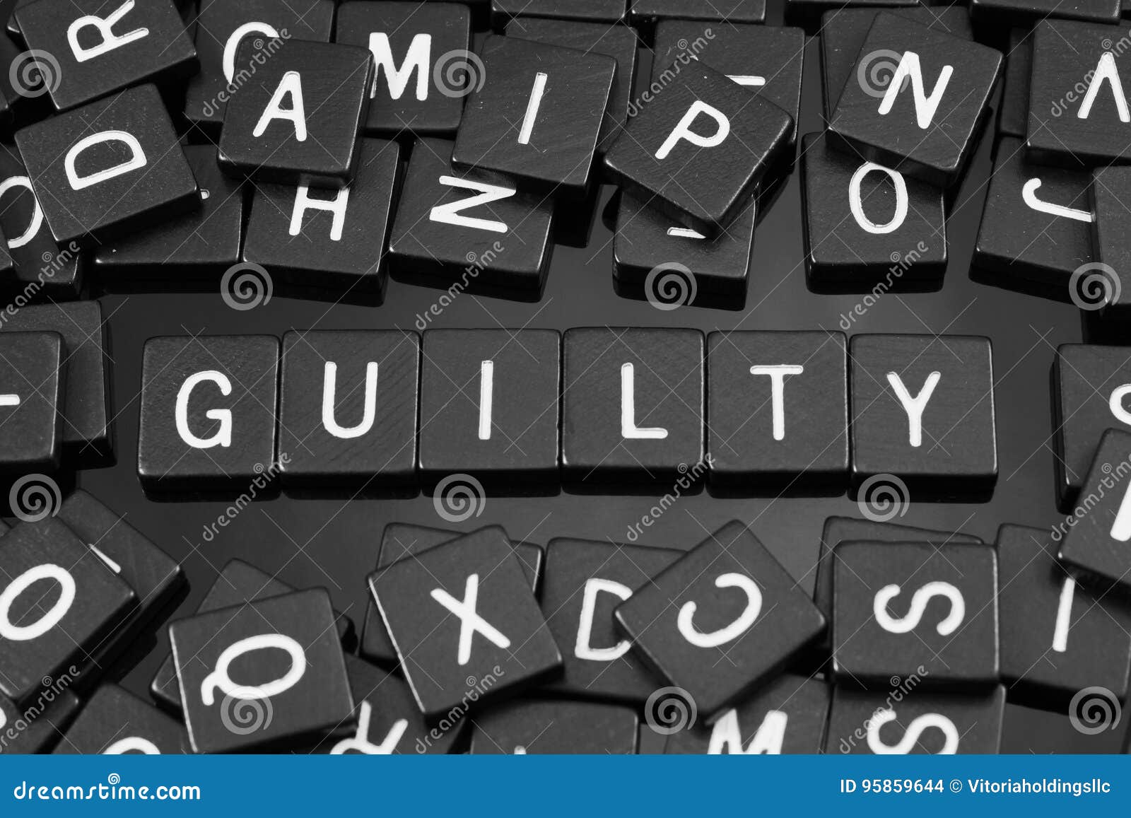 Black Letter Tiles Spelling the Word & X22;guilty& X22; Stock Photo ...