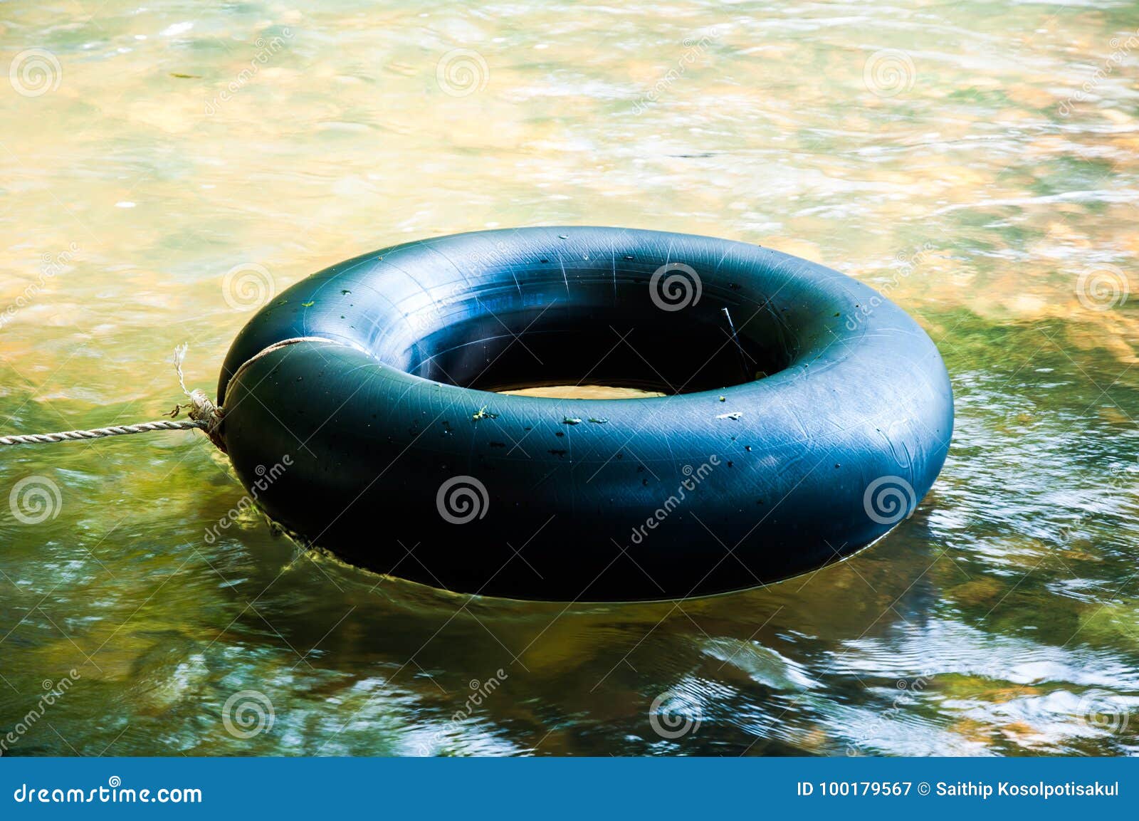 Black Life Ring Floating on Water. Stock Image - Image of floating ...