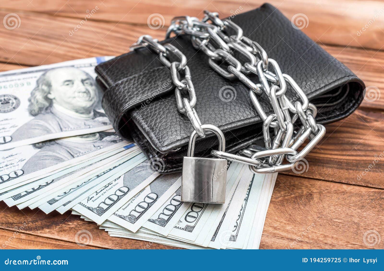 Black Locked Wallet by Chain with Padlock and Money on the Table Stock ...