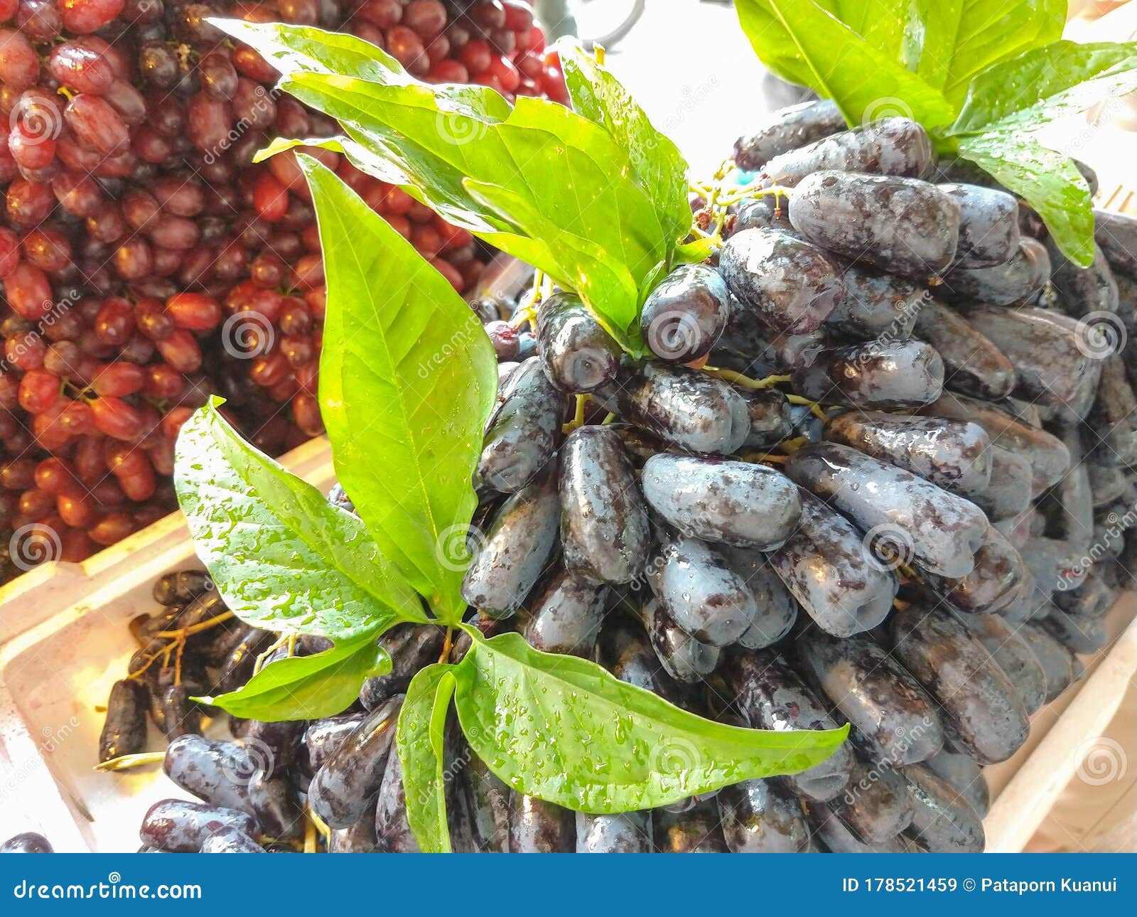 Black and long grape fruit stock image. Image of exotic - 178521459