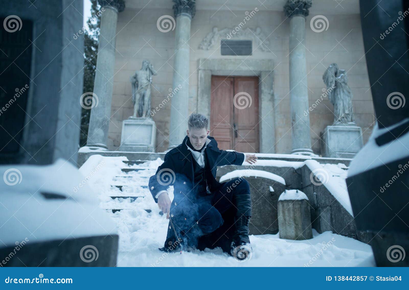 Black Magician Makes a Spell with the Help of Magic Wand and Smoke ...