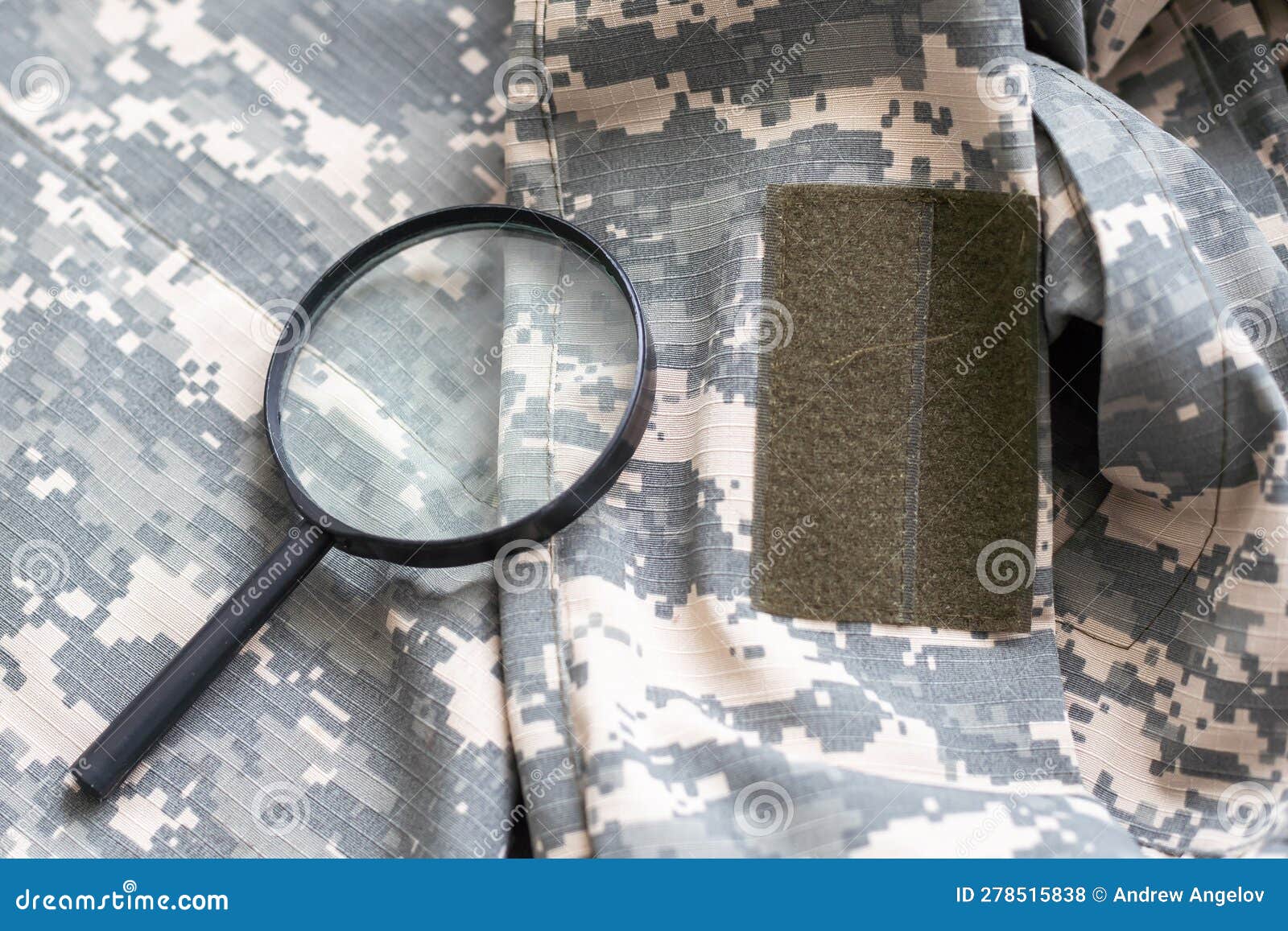Black Magnifier on Green Military Uniform Stock Photo - Image of ...