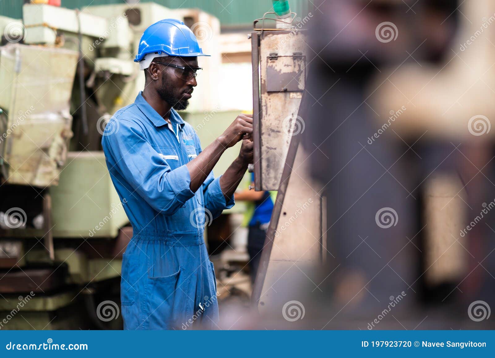 Black Male Engineer Working on Machine in Factory. Black Man Engineer ...