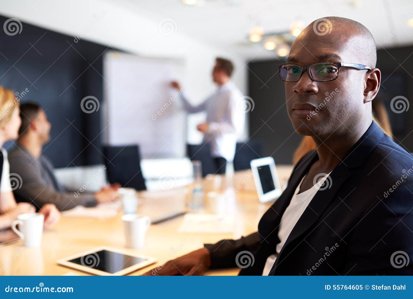 Black Male Executive Facing Camera with Serious Expression Stock Image ...