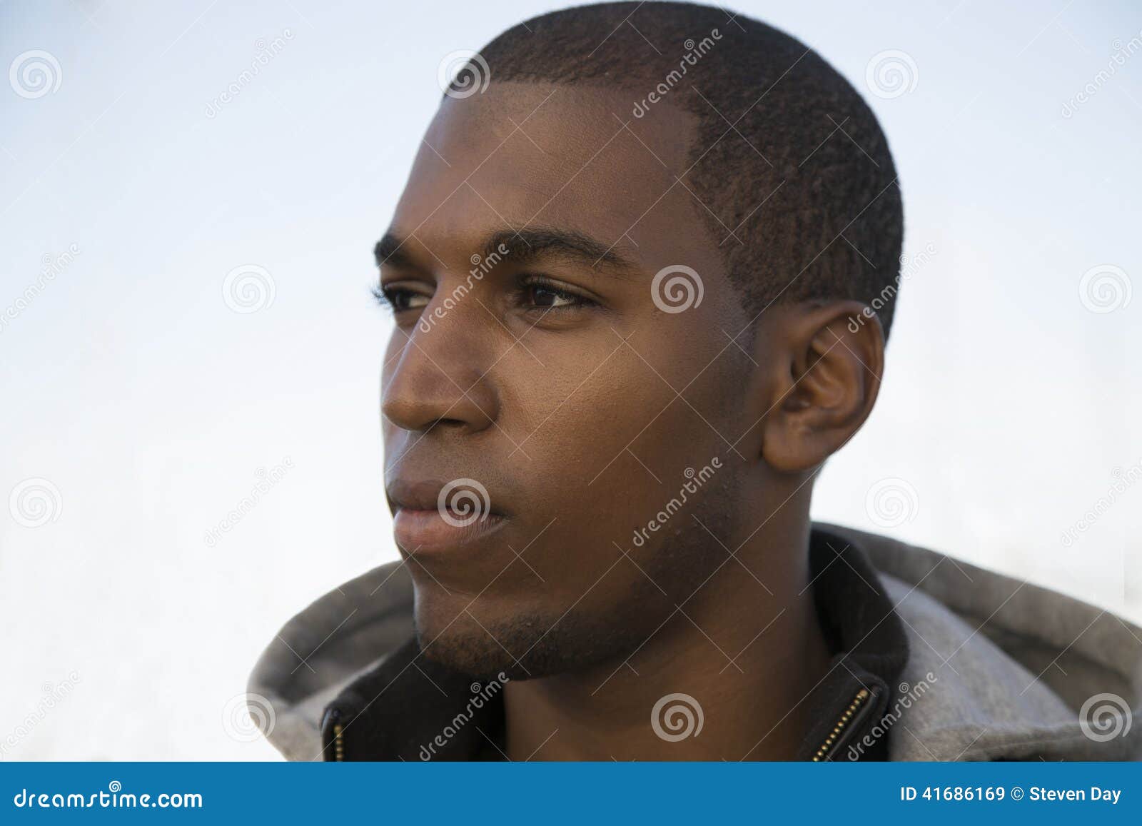 Black Male Model Wearing a Hoodie with a Serious Expression Stock Image ...