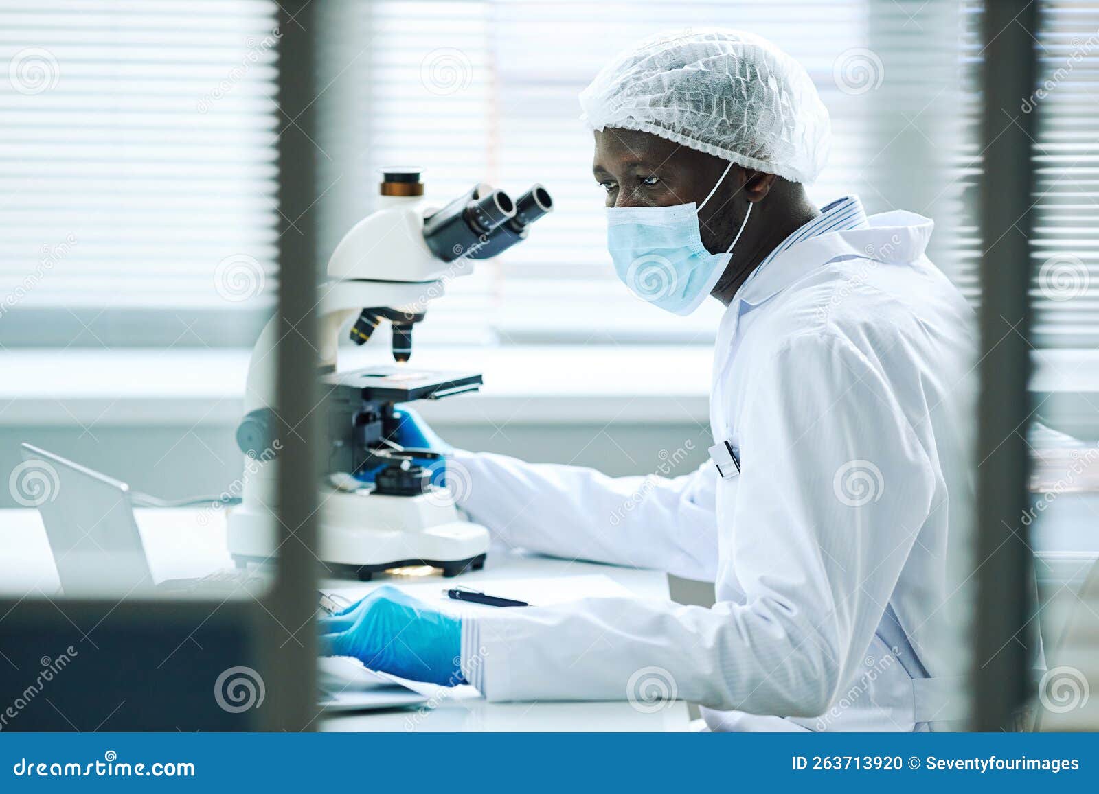 Black Male Scientist Working in Laboratory with Microscope Stock Photo ...