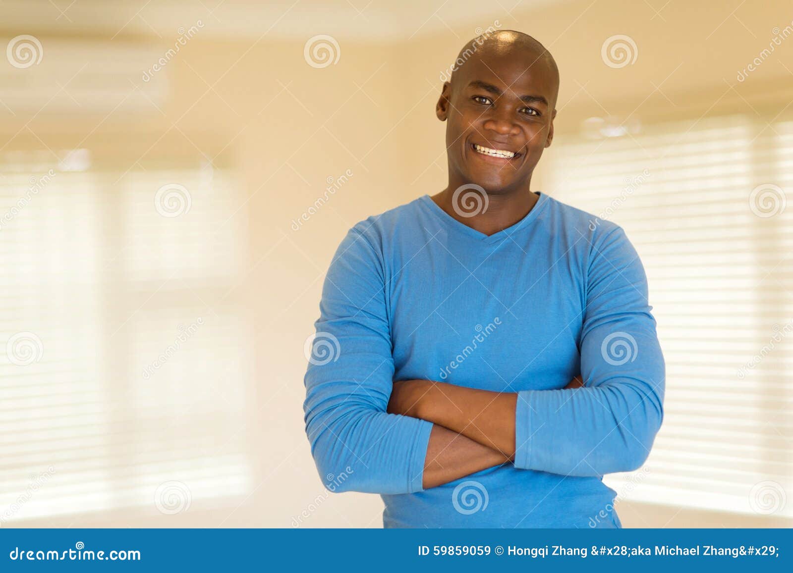 Black man arms folded stock image. Image of indoors, empty - 59859059