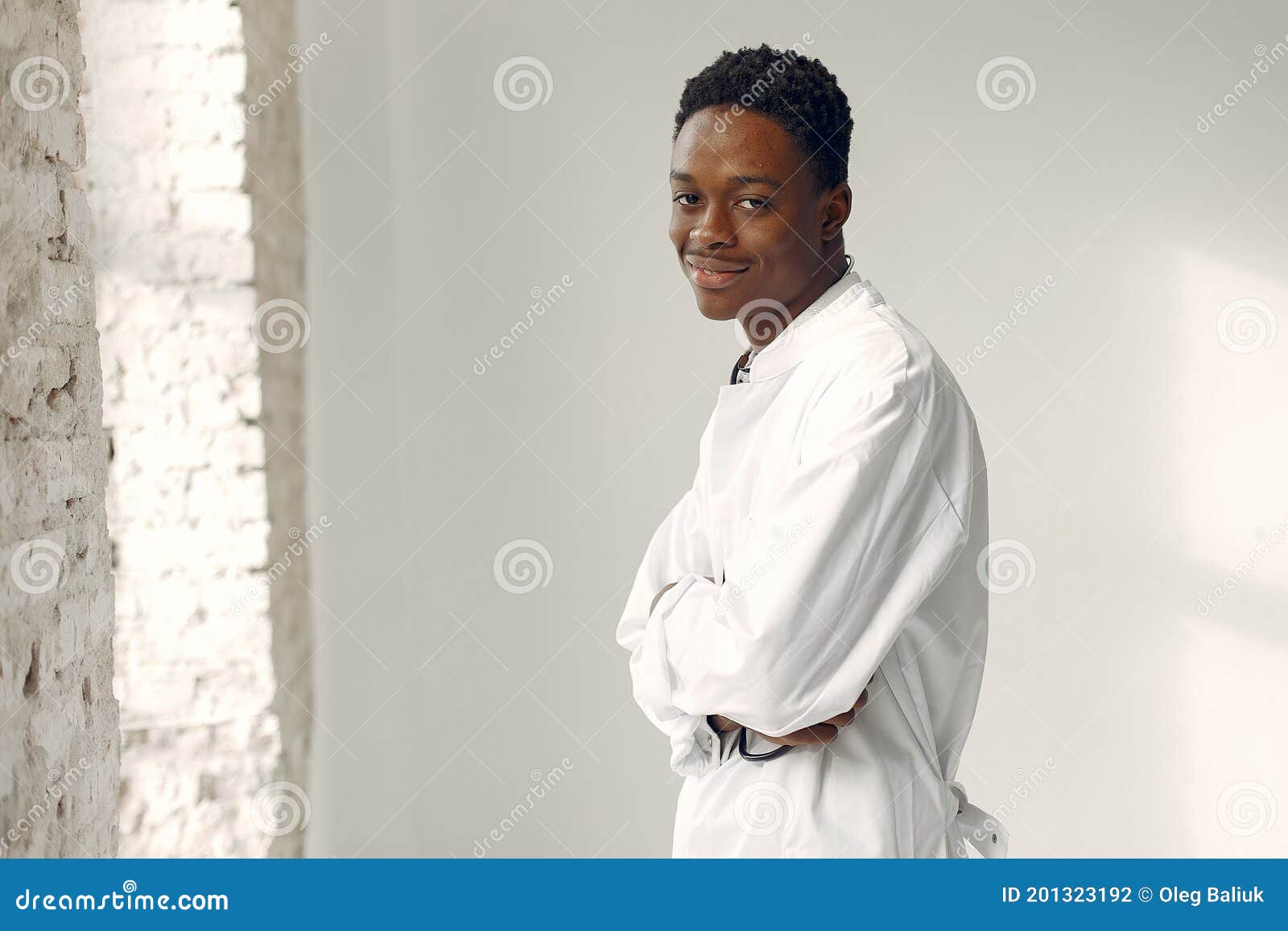 Handsome Black Doctor in a White Uniform with a Stethoscope Stock Photo ...