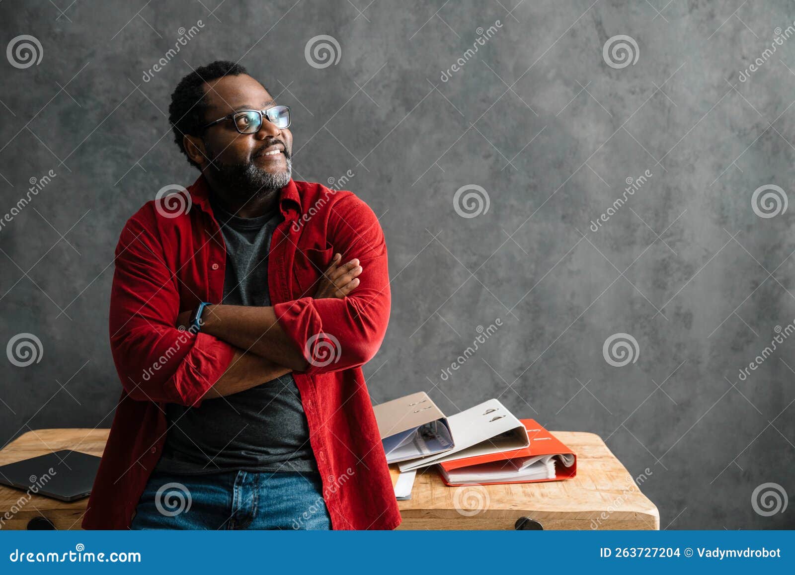 Black Man in Eyeglasses Smiling while Working in Office Stock Photo ...