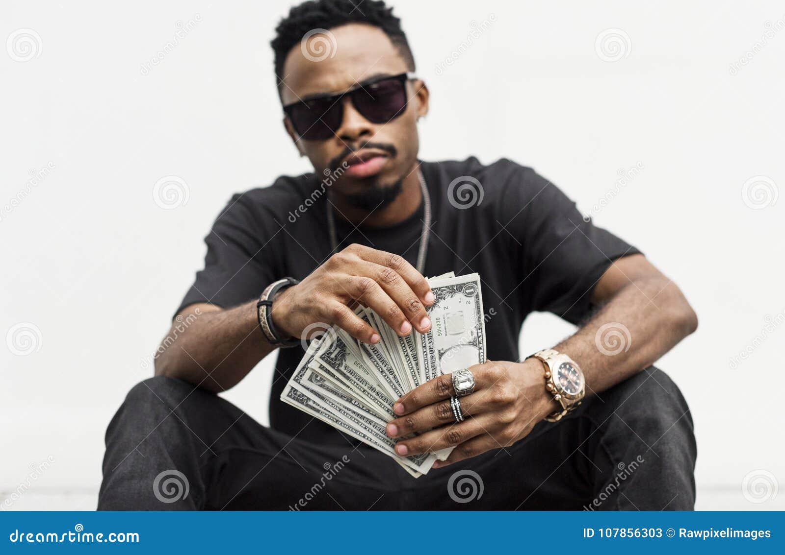 Black Man Holding Cash Bills Stock Image - Image of scale, gray: 107856303