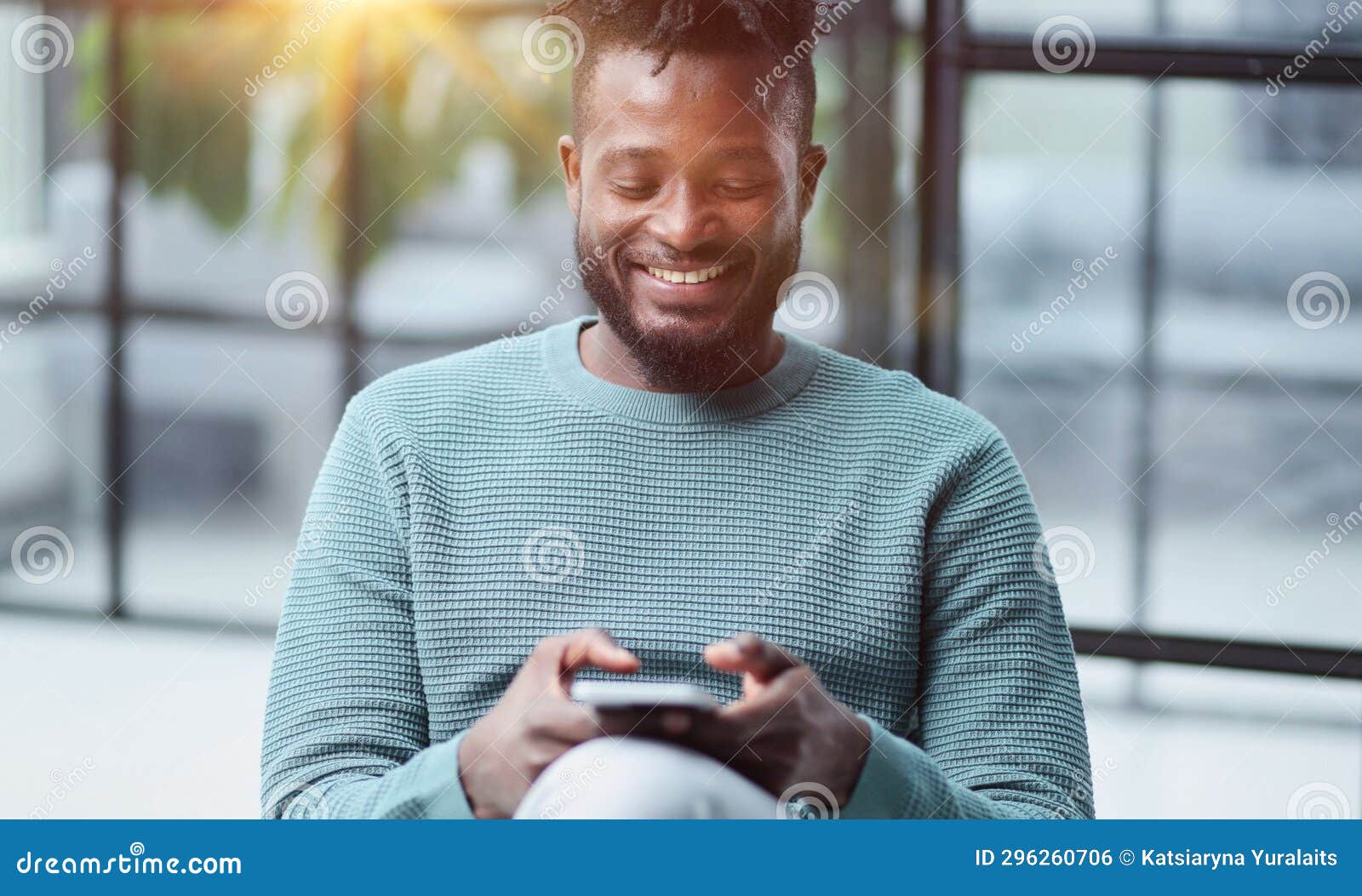 Black Man Looking at Smartphone Browsing Internet, Office Technology ...