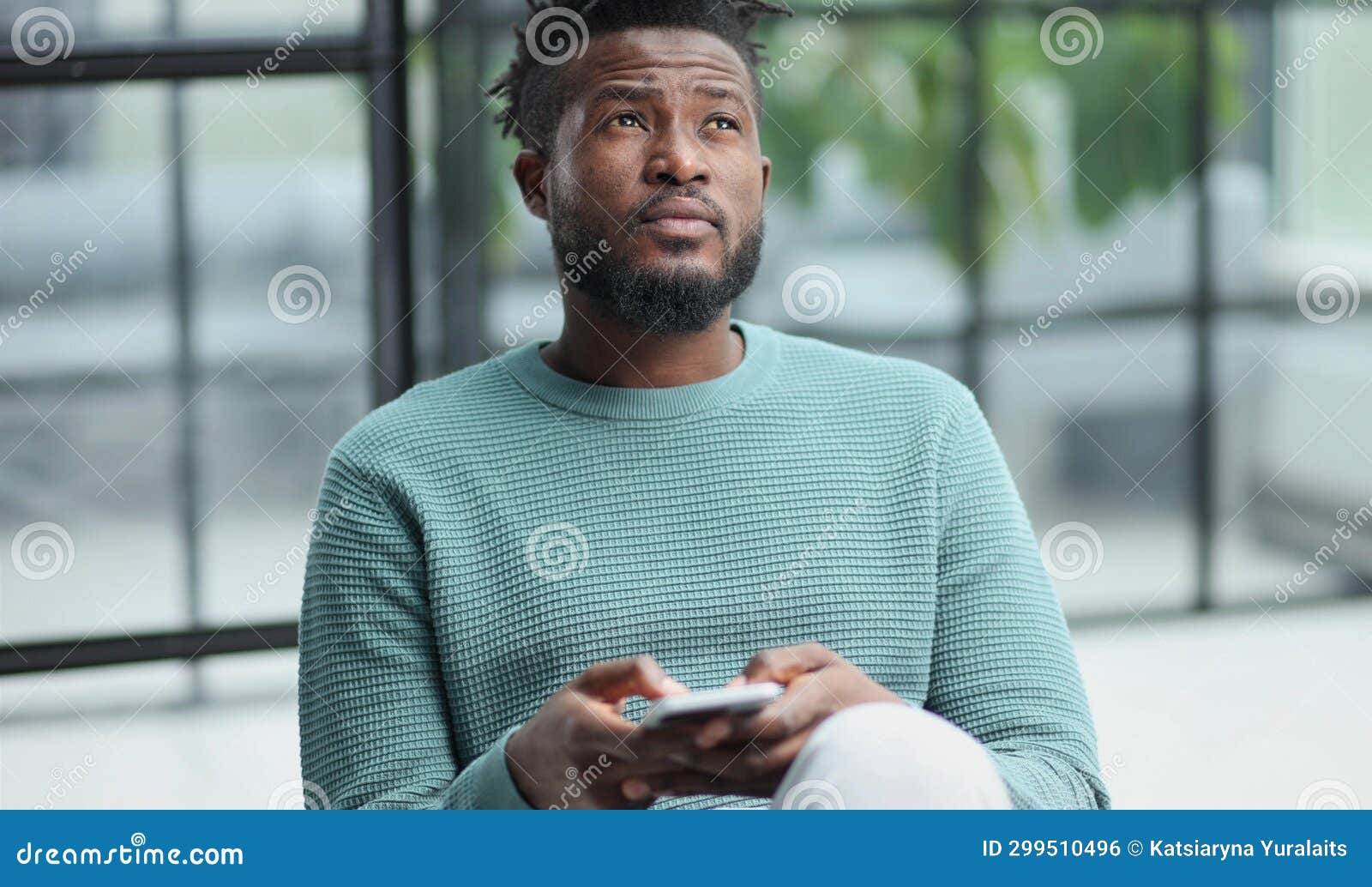 Black Man Looking at Smartphone Browsing Internet, Office Technology ...