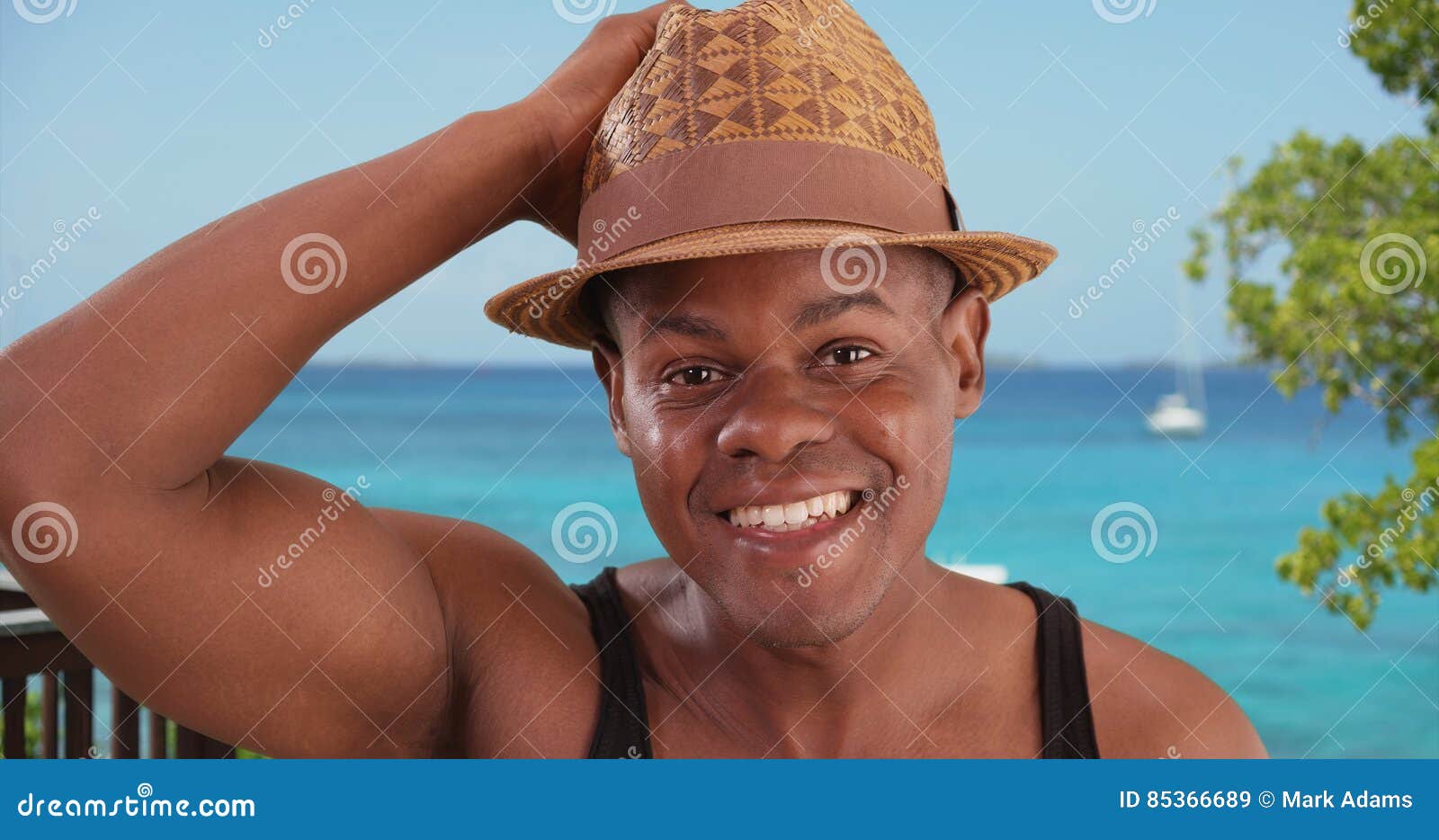 Black Man Poses Happily for a Portrait by the Beach Stock Image - Image ...