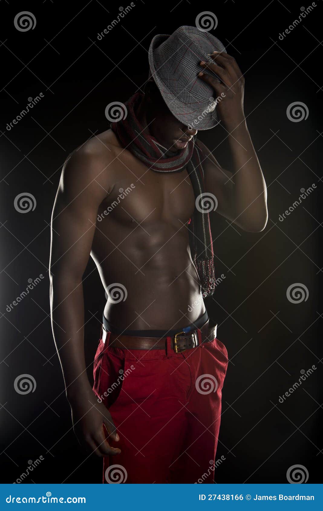 Black man removing his hat stock photo. Image of beauty - 27438166