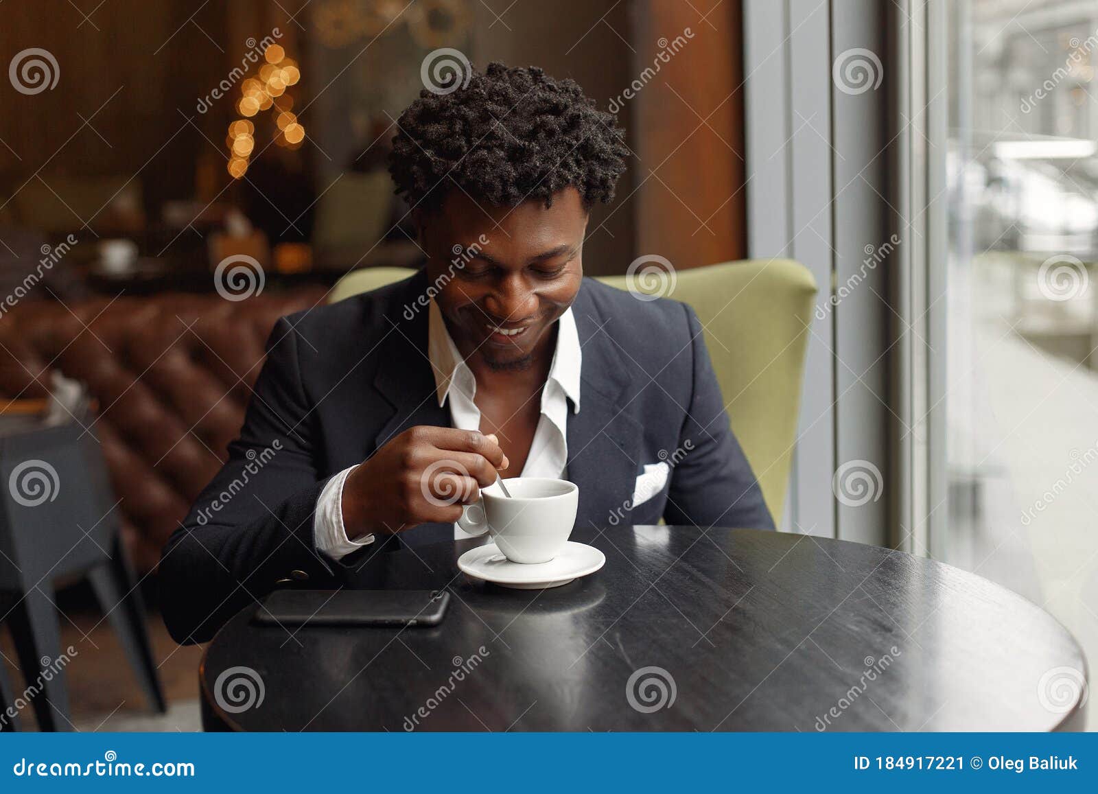 Black Man Sitting in a Cafe and Drinking a Coffee Stock Image - Image ...