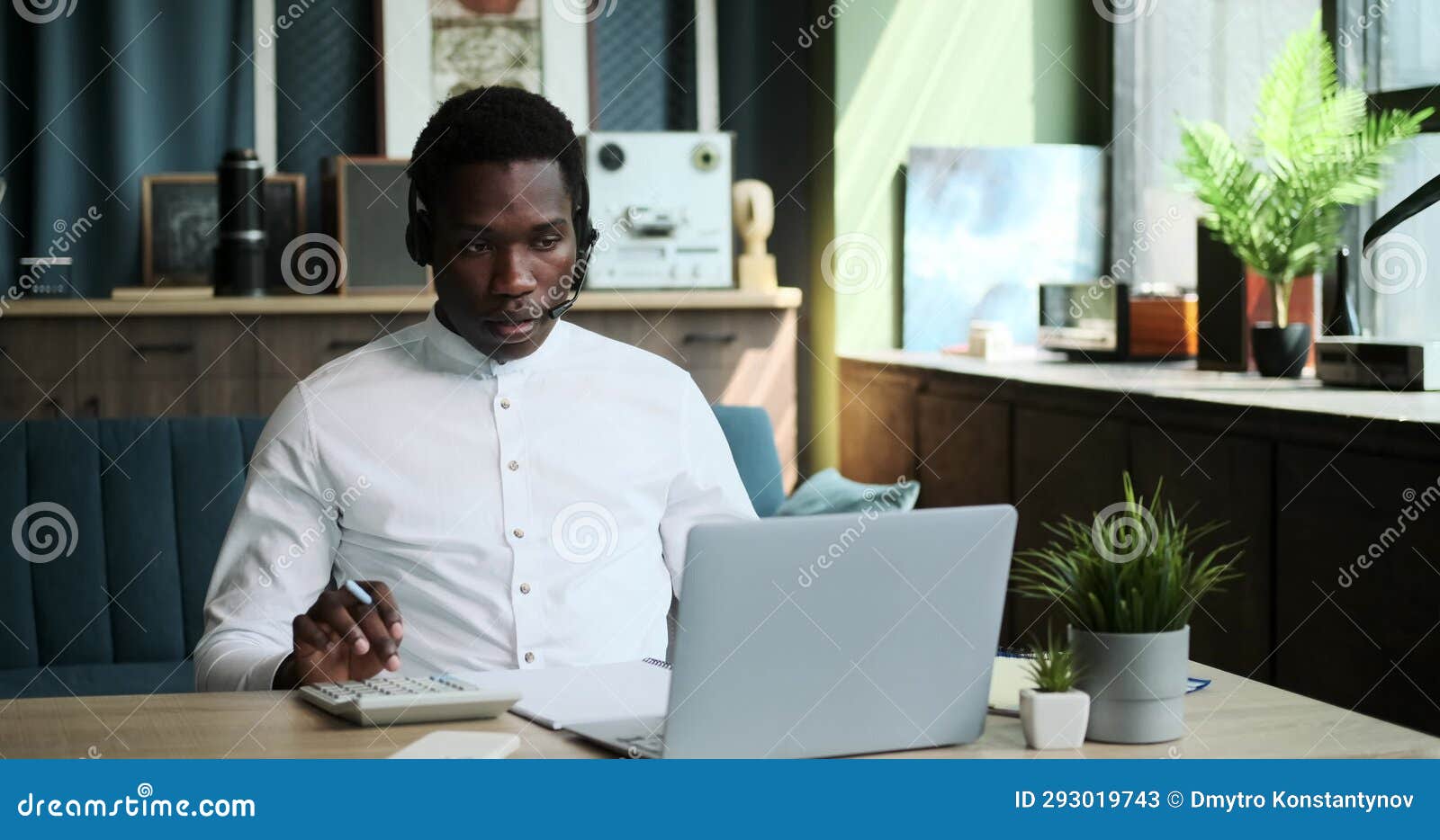 Black Man Using Calculator during Work Call Stock Video - Video of ...