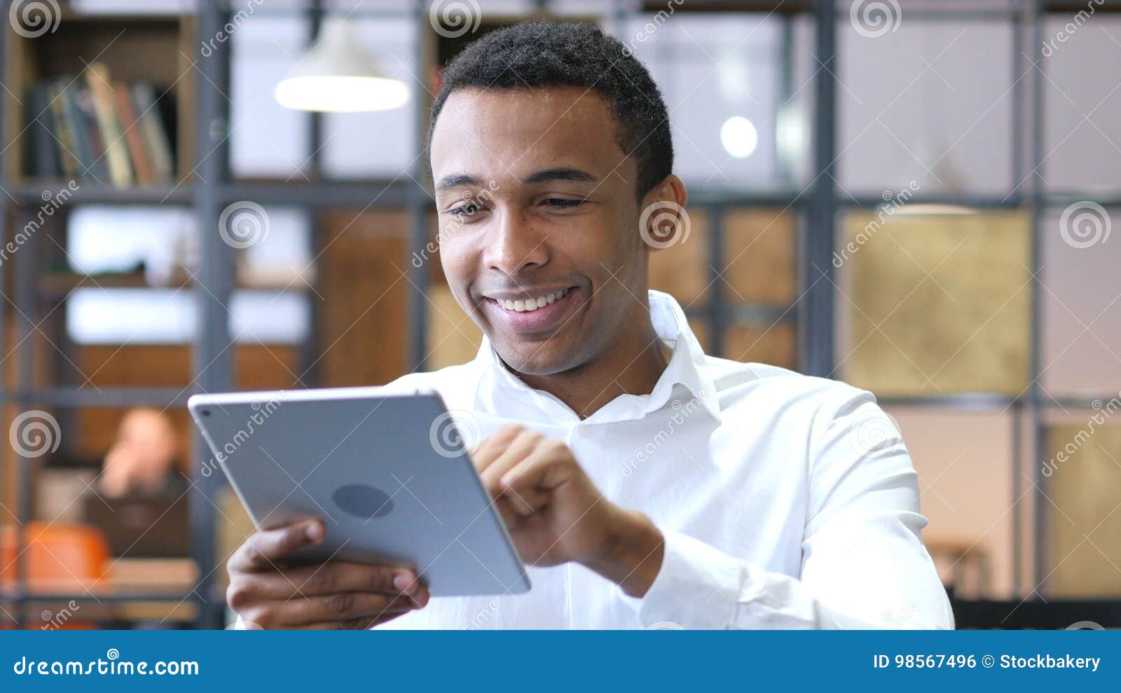 Black Man Using Tablet in Office Stock Photo - Image of business ...