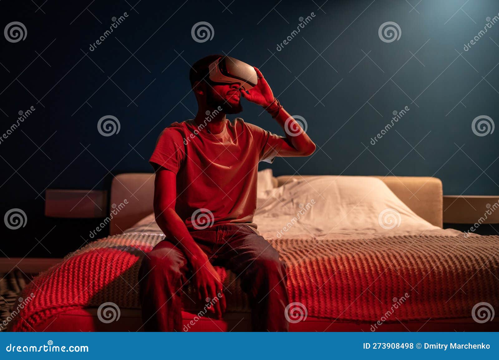 Black Man Using Virtual Reality Headset at Home with Neon Light, Sit on ...