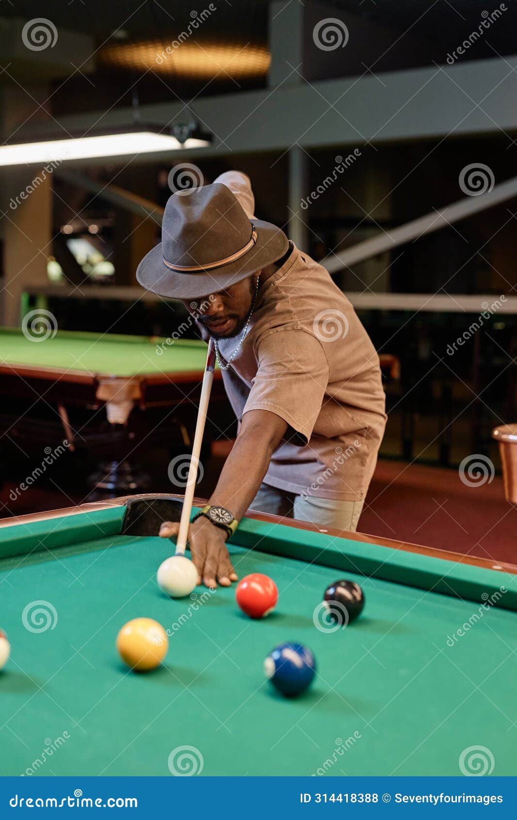Black Man Wearing Hand and Playing Pool at Pool Table Stock Photo ...