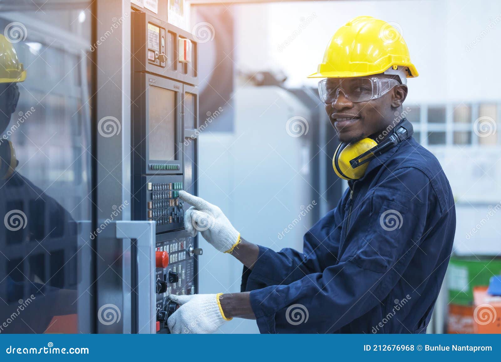 Black Man Working at Programmable Machine in Factory Industries Stock ...
