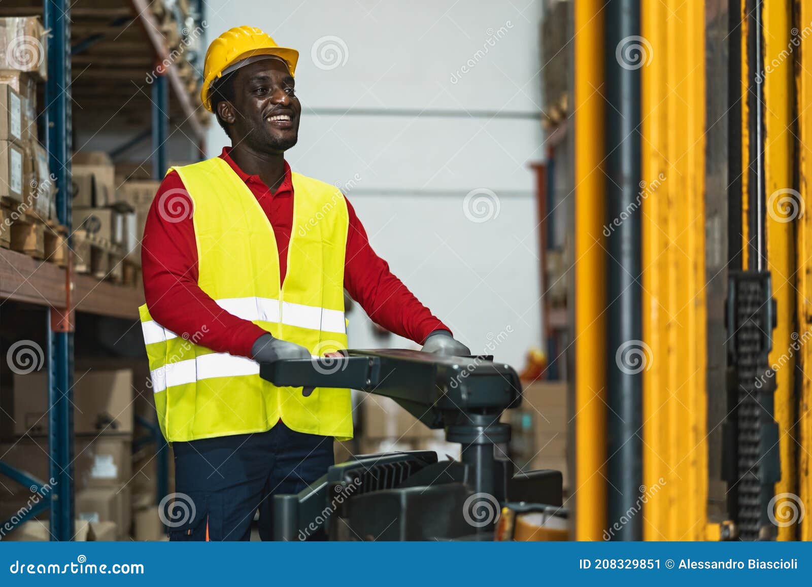 Black Man Working in Warehouse with Forklift Loading Delivery Boxes ...