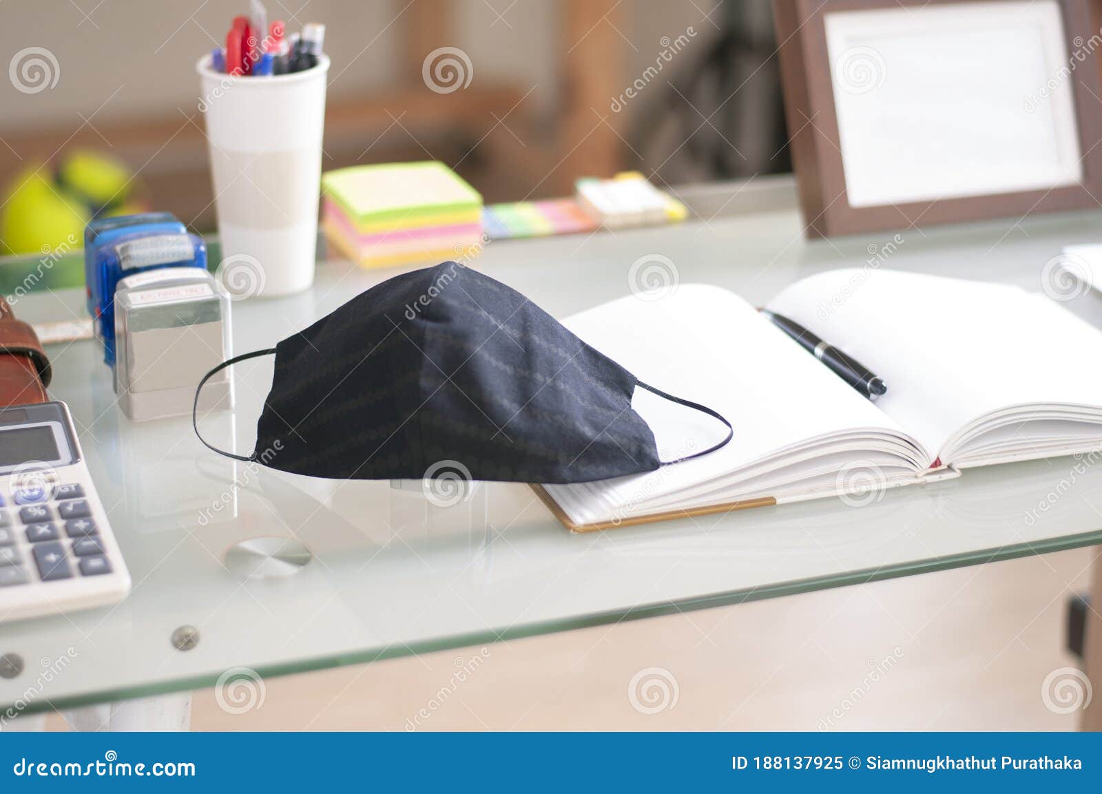 Black Mask on the Work Table To Protect Virus and Dust Stock Image ...