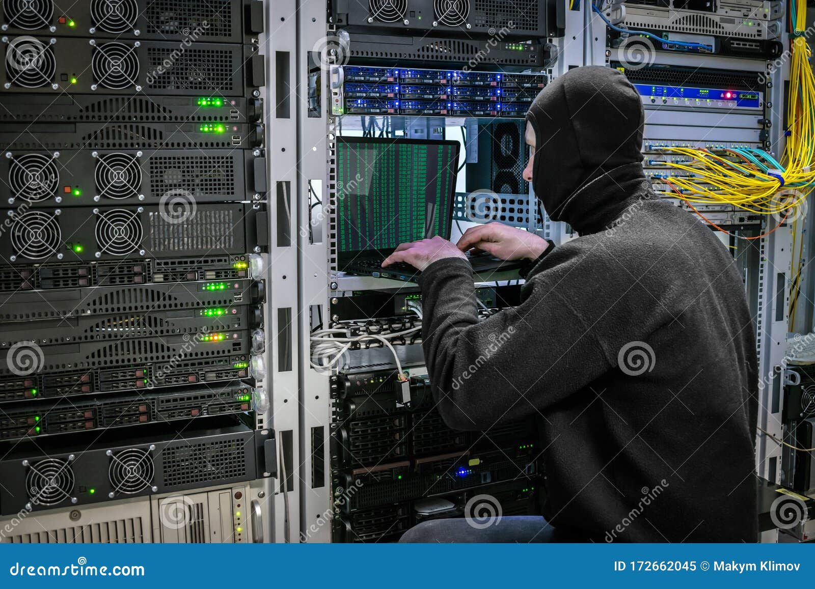 A Black Masked Hacker Hacks into the Protection of the Server Room ...