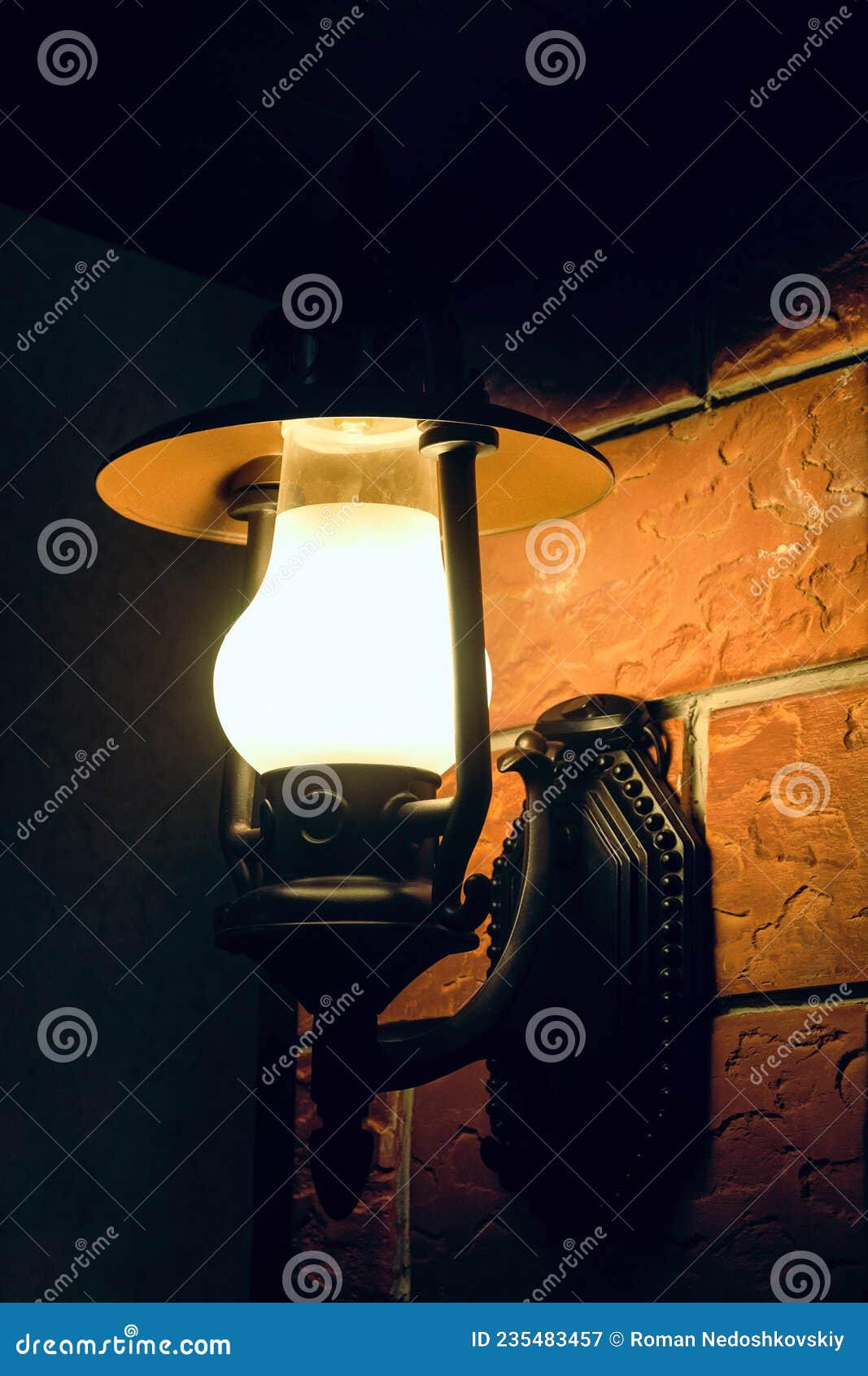 Black Metal Classic Lantern with with Glazed Lamp on Brick Column Stock ...