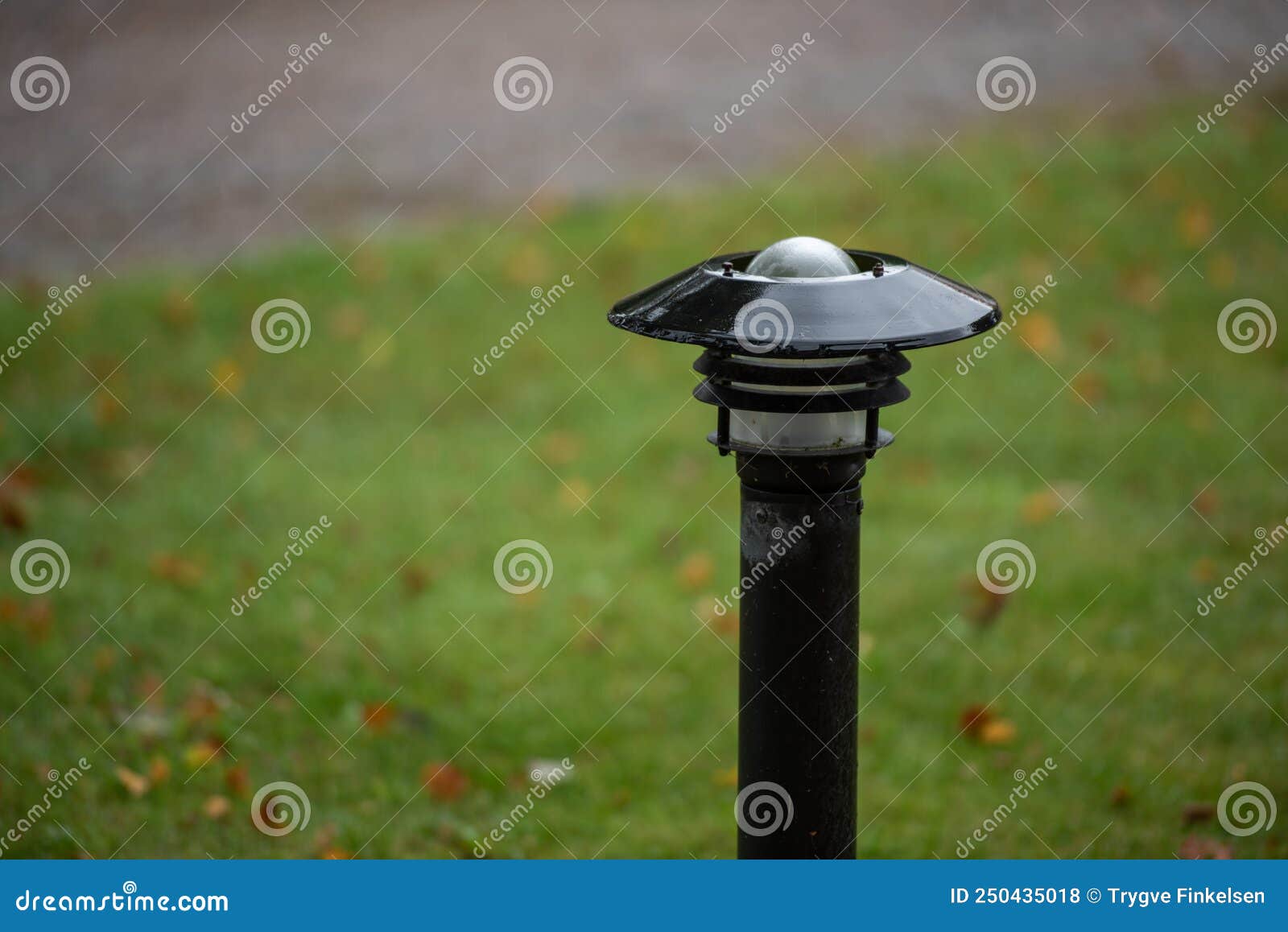 A Black Metal Lamp Post by a Field.. Stock Photo - Image of post, night ...