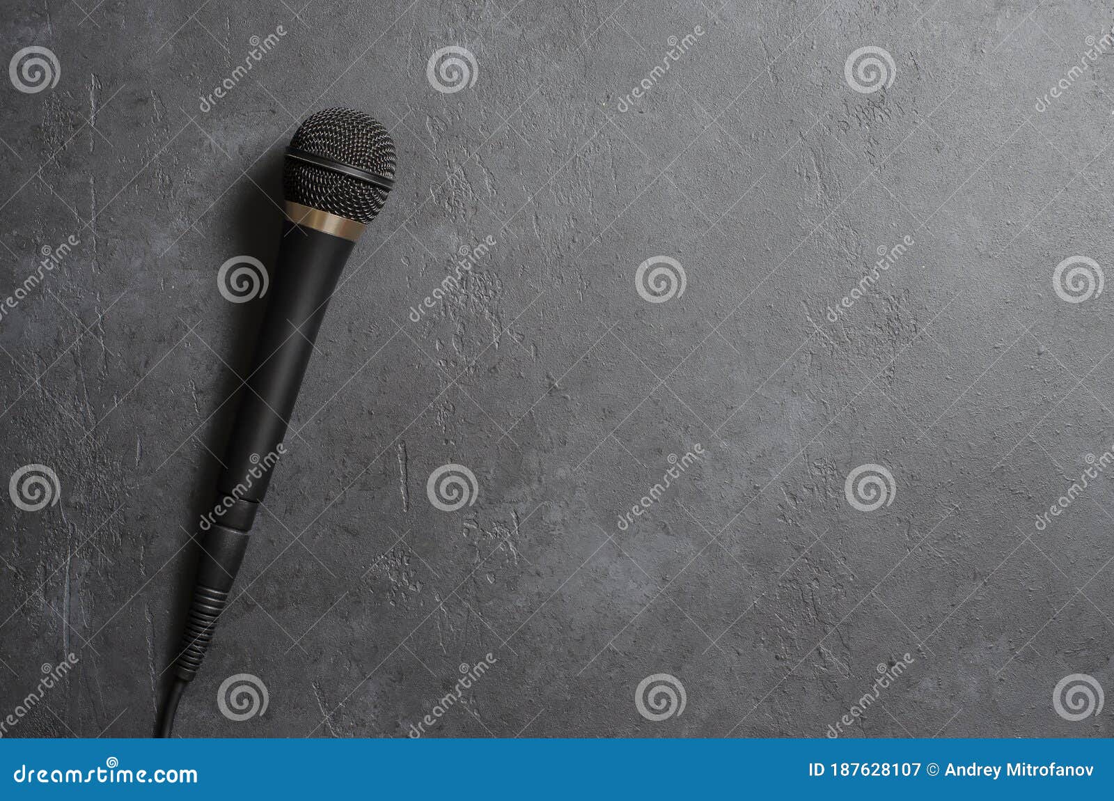 Black Microphone on a Dark Concrete Background. Equipment for Vocals or ...