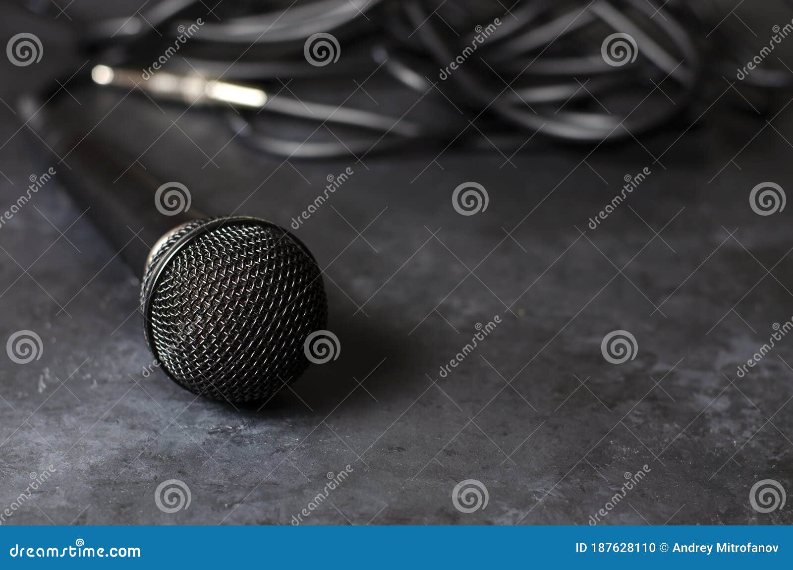Black Microphone on a Dark Concrete Background. Equipment for Vocals or ...