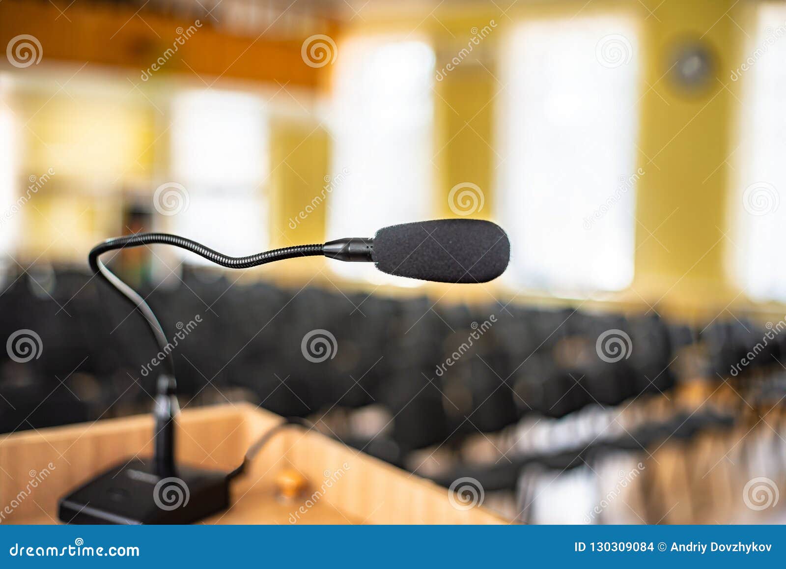Black Microphone in an Empty Conference Hall, Empty Chair, Ready for ...