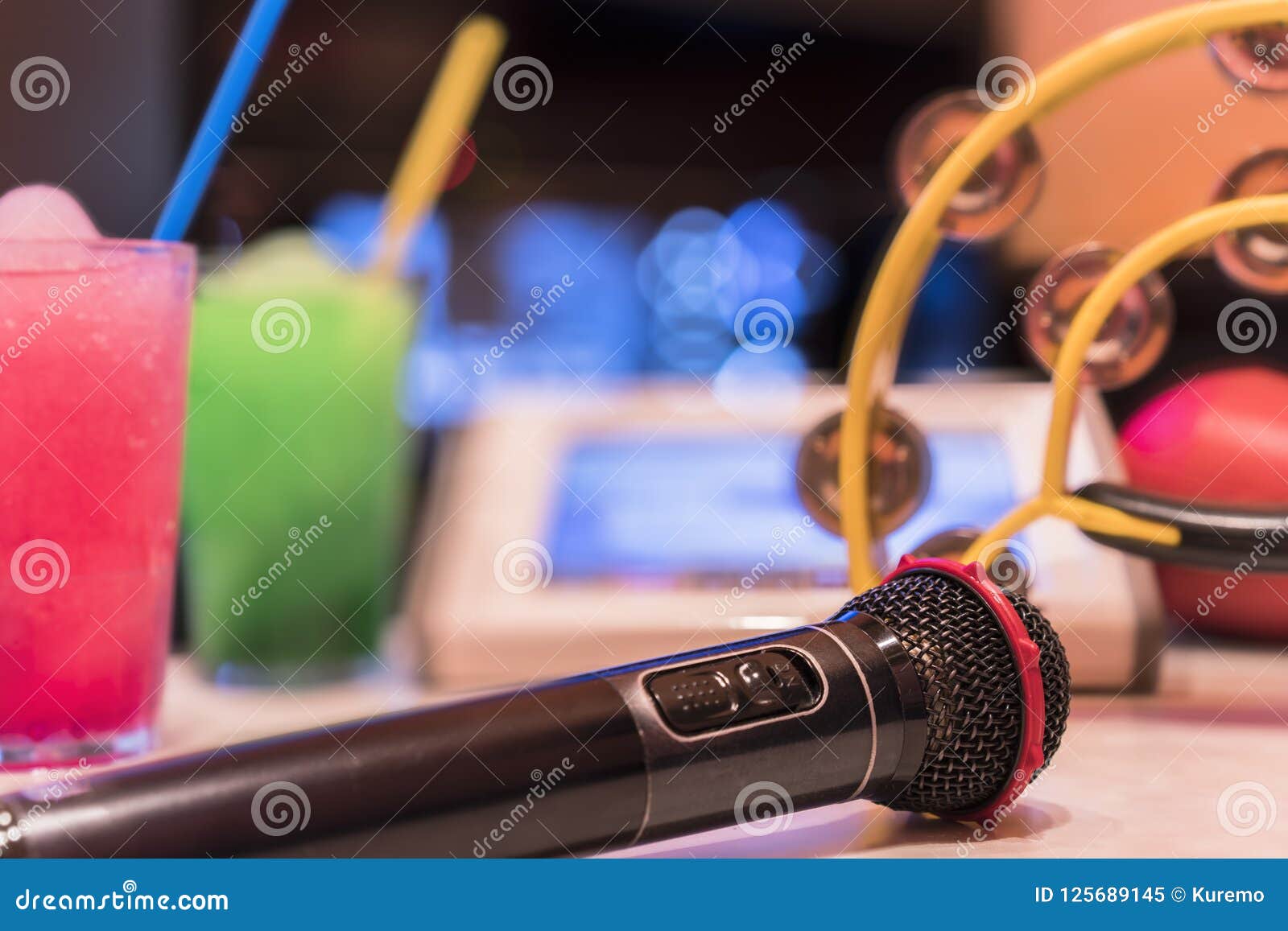Black Microphone in Karaoke Club, with Remote Controller, Melon Stock ...